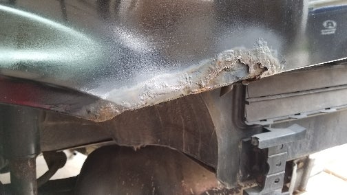 Has anyone repaired the quarterpanel rust spot over the rear bumper ...