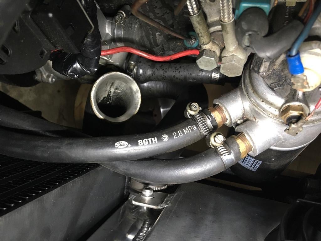Coolant hose lower adapter coolant pump to metal crack pipe which one ...