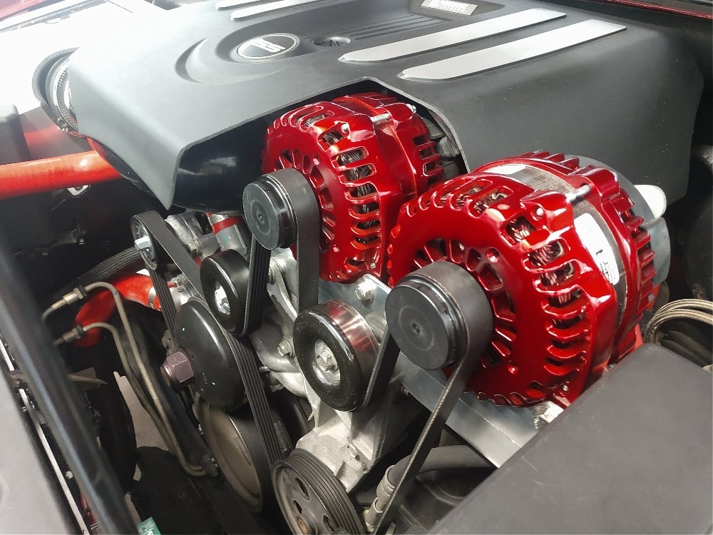 I want to add aftermarket amps, what can a stock alternator handle ...